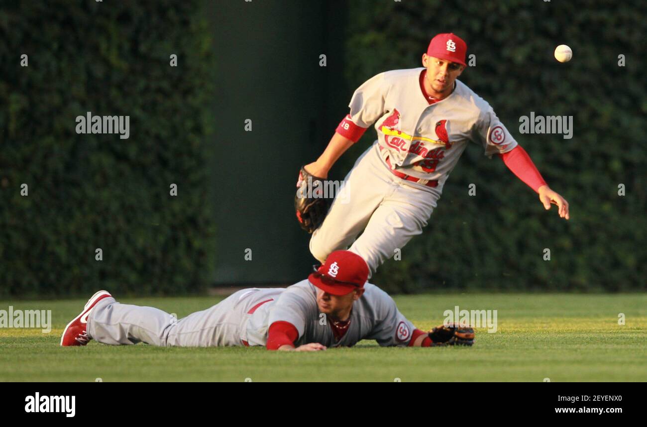 St. Louis Cardinals' Jon Jay goes after a ball that Allen Craig couldn ...