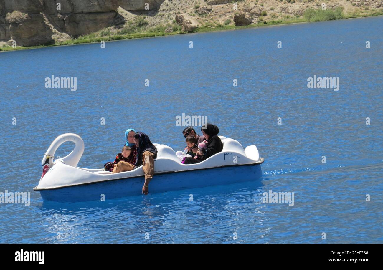 Afghans partake of the popular swan boats of Band-e Amir. Several ...