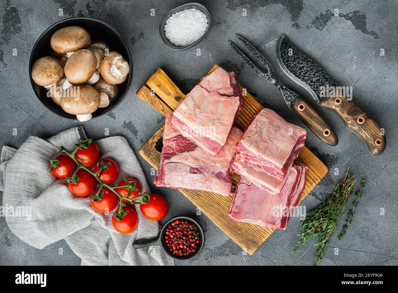 Raw veal calf short rib meat set, with ingredients, on gray stone ...