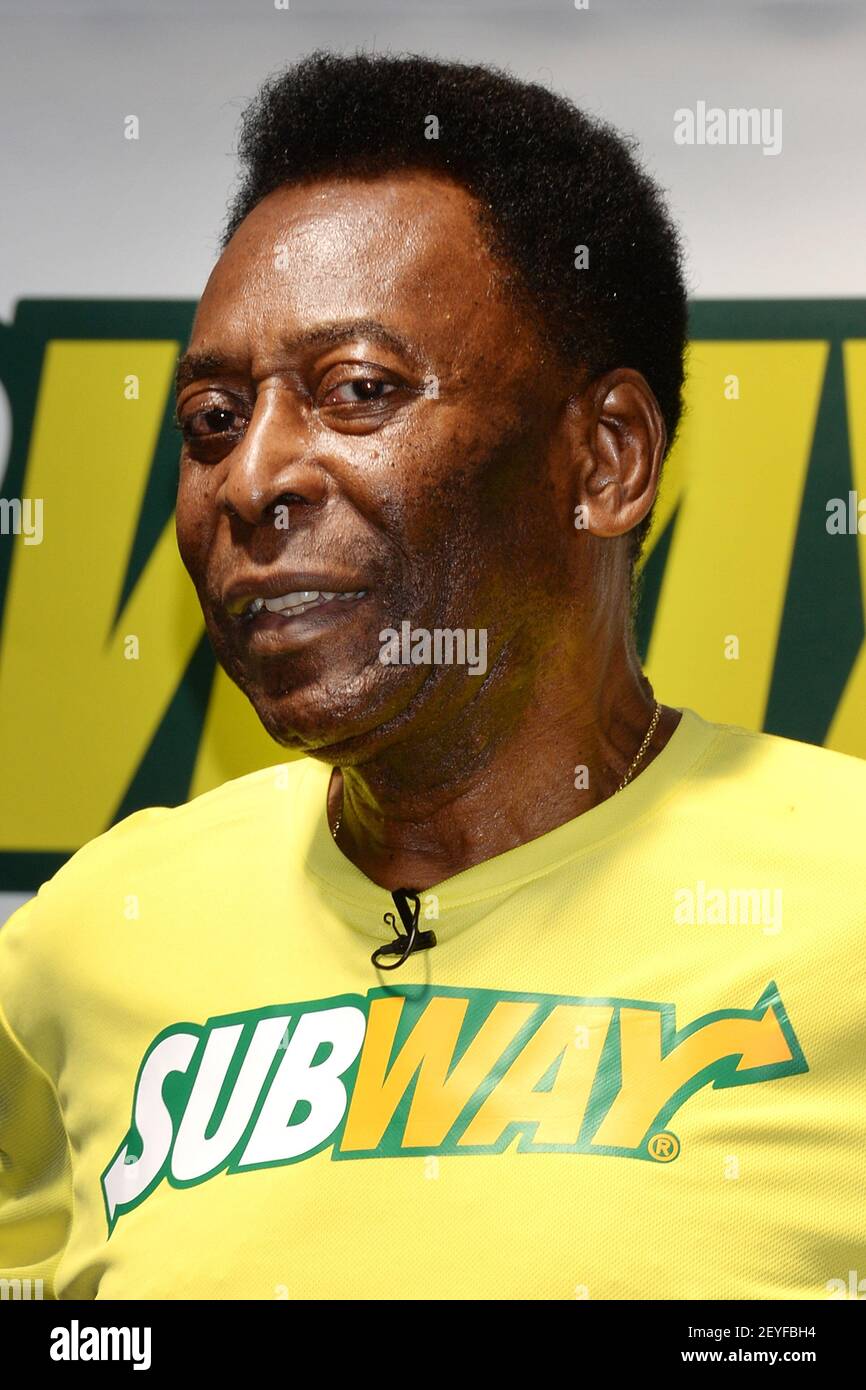 Brazilian Soccer legend Pele (yellow shirt) attends the announcement of ...