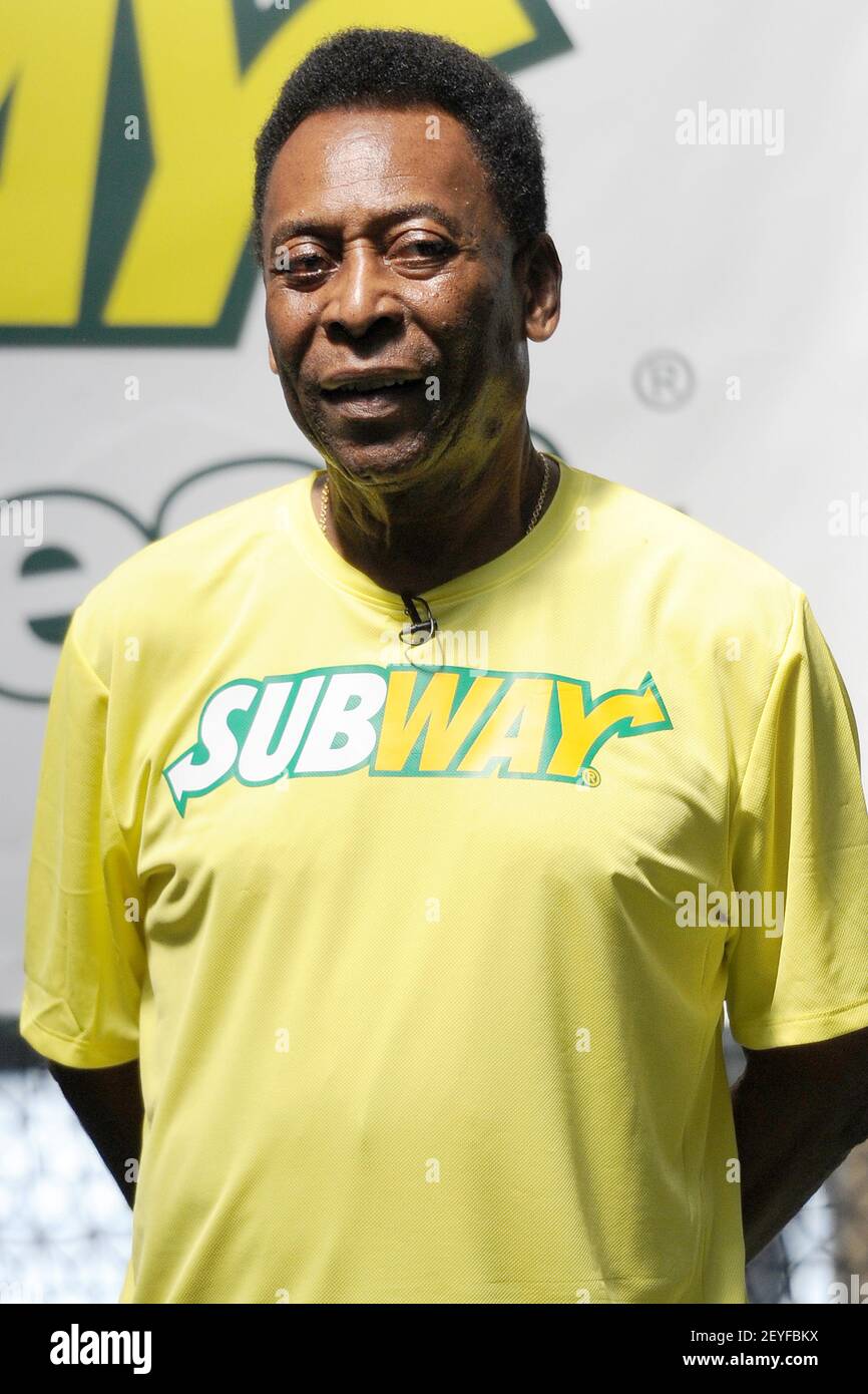Brazilian Soccer legend Pele (yellow shirt) attends the announcement of ...