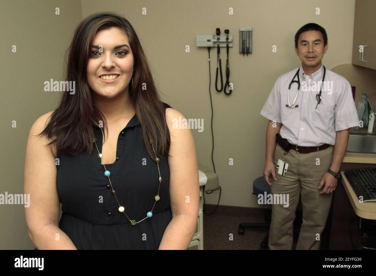 Pulmonary critical care physician Dr. Huy Duong, right, pictured July ...