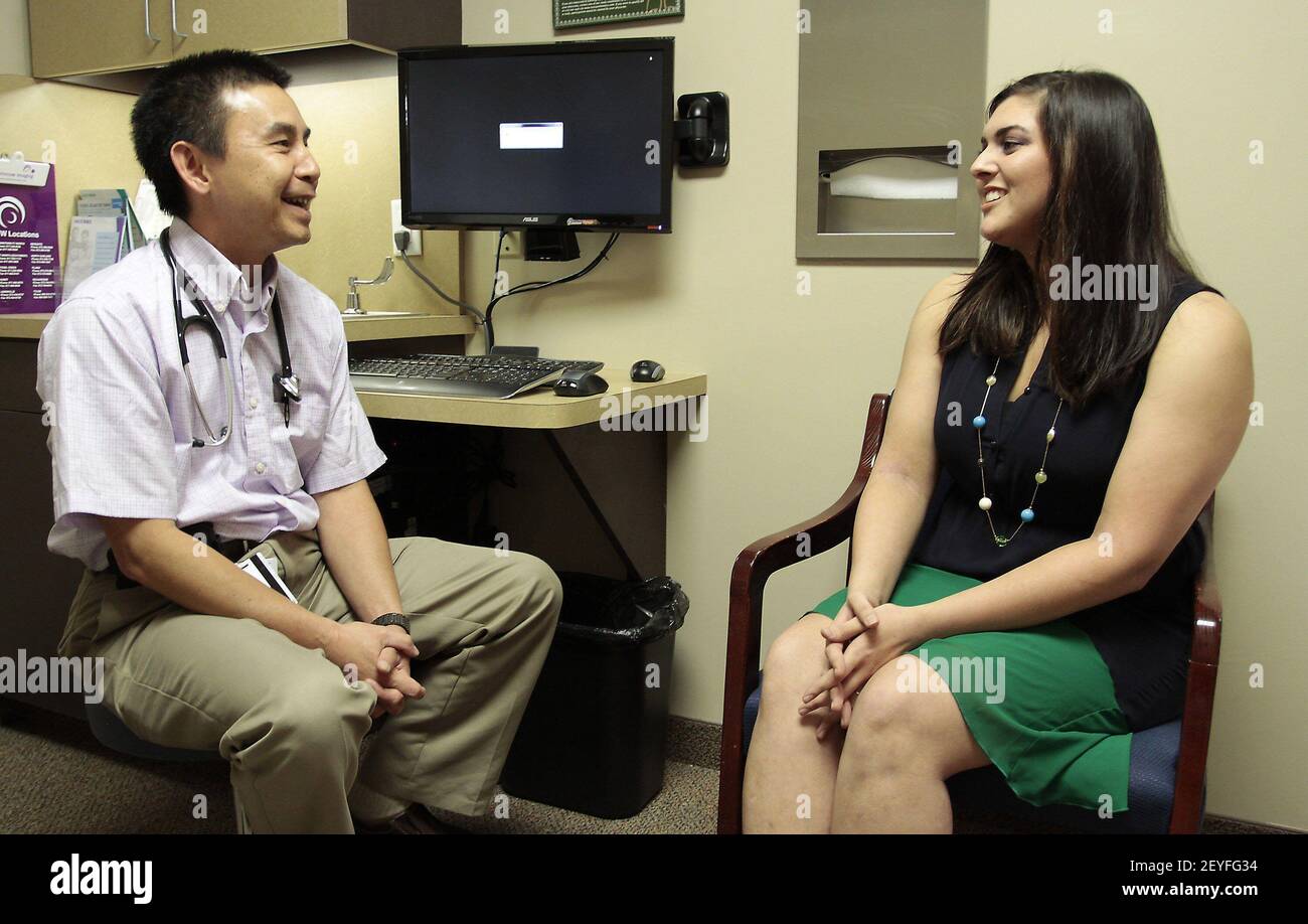 Pulmonary critical care physician Dr. Huy Duong, left, pictured July 25 ...