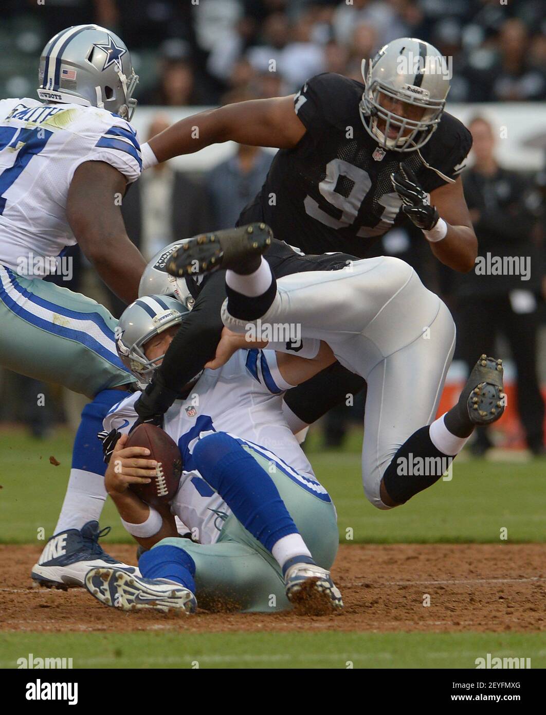 The Oakland Raiders' Sio Moore (55) sacks Dallas Cowboys quarterback ...