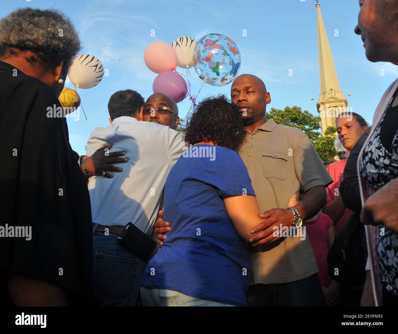 Joann Mitchell, middle, with supporters at a vigil at Margaret Tucker ...