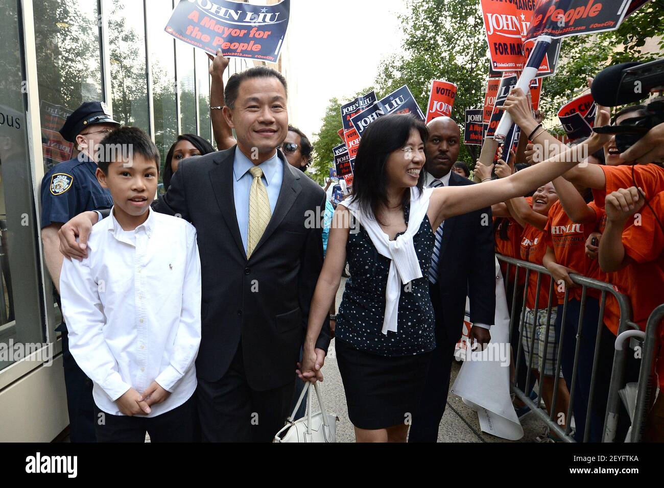New York City Democratic Mayoral Candidate John Liu (Center) arrives with his son Joey Lui (L ...