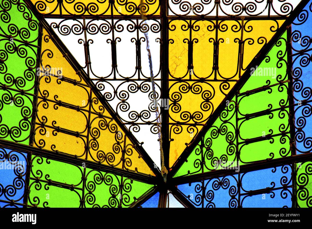 Colorated glass and sun in morocco and light Stock Photo - Alamy