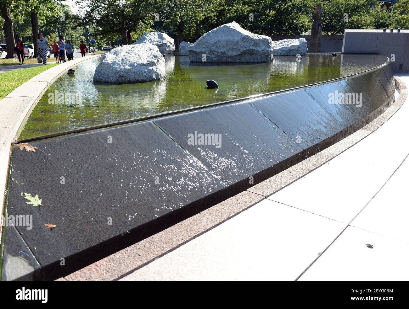 A large pool borders one side of the Japanese American Memorial to ...