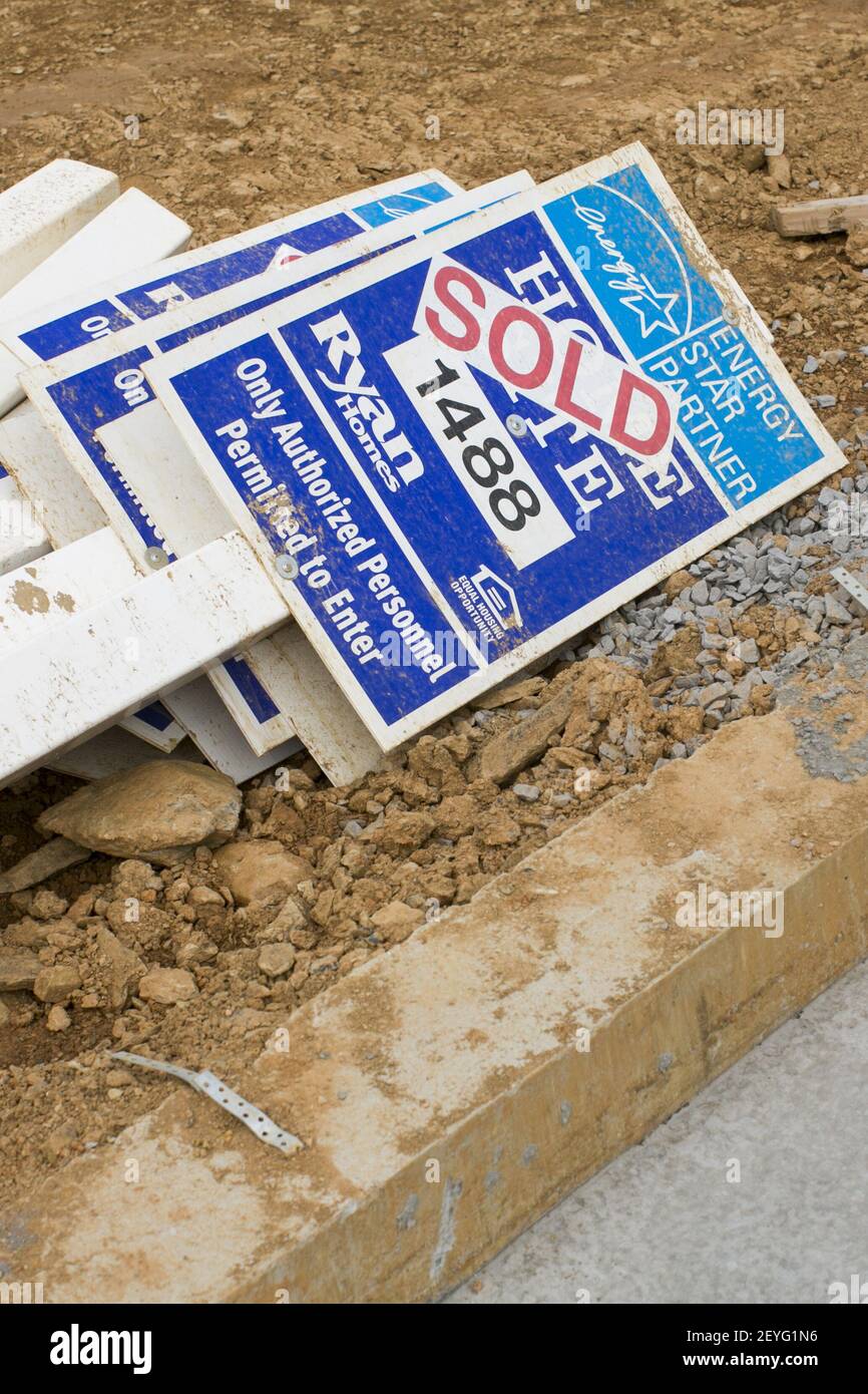 New home construction showing "Sold" signs at a Ryan Homes and NV Homes ...