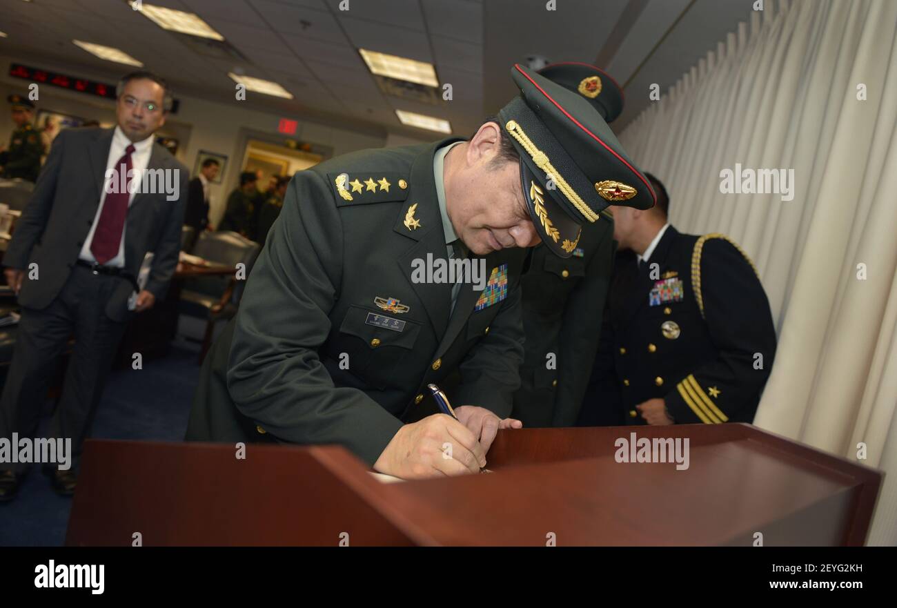 China's Minister of National Defense Gen. Chang Wanquan signs the ...