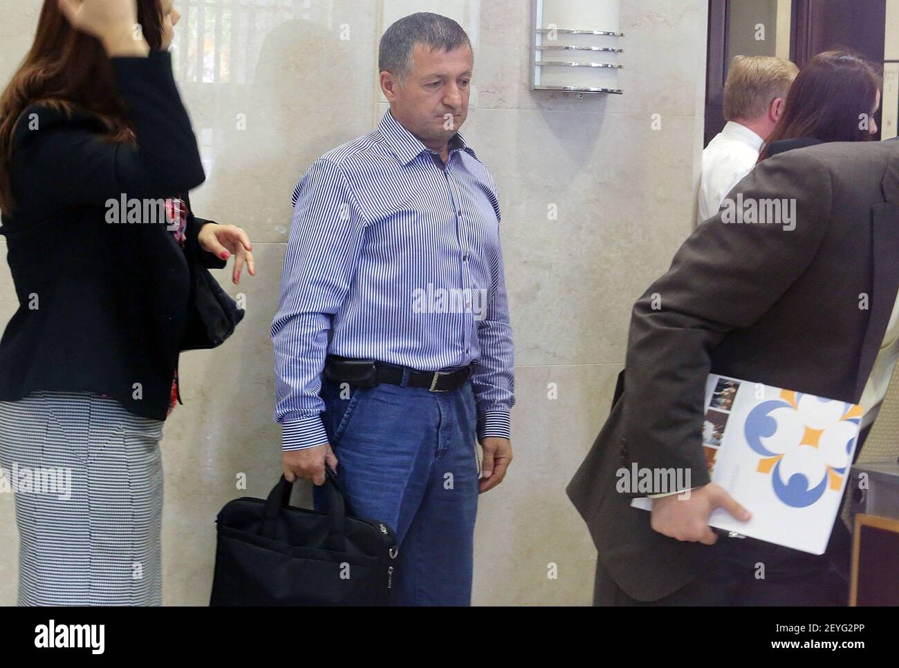 After going through security, Abdulbaki Todashev, center, the father of ...
