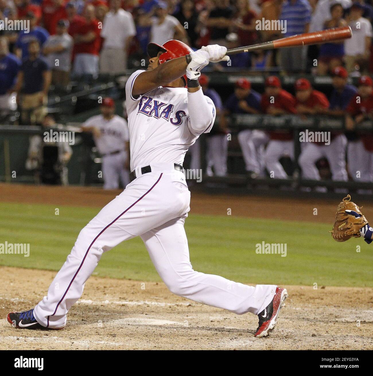 Texs Rangers' Elvis Andrus hits a sacrifice fly to score Adam Rosales ...