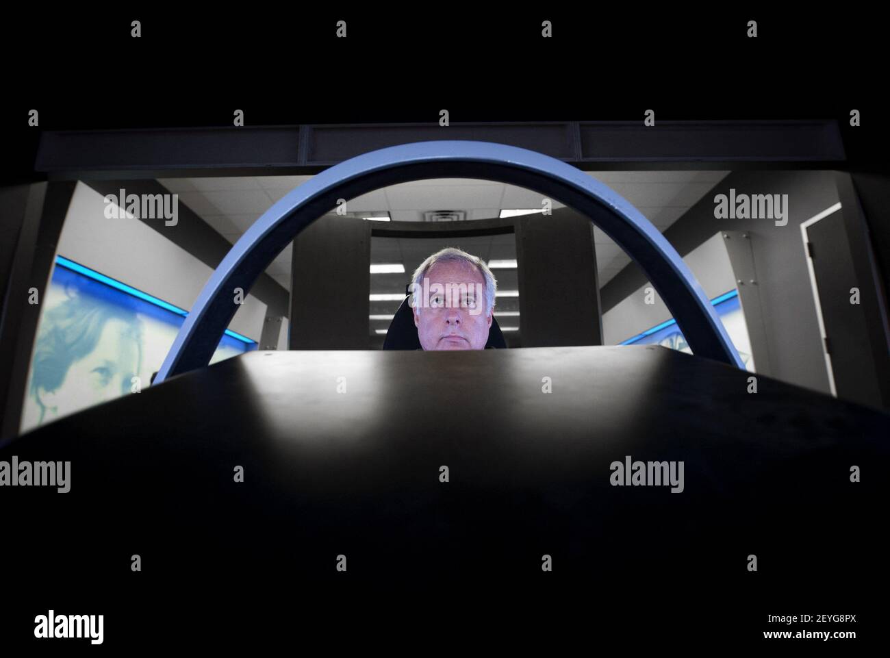 Lockheed Martin test pilot Alan Norman sits in the cockpit simulator of ...