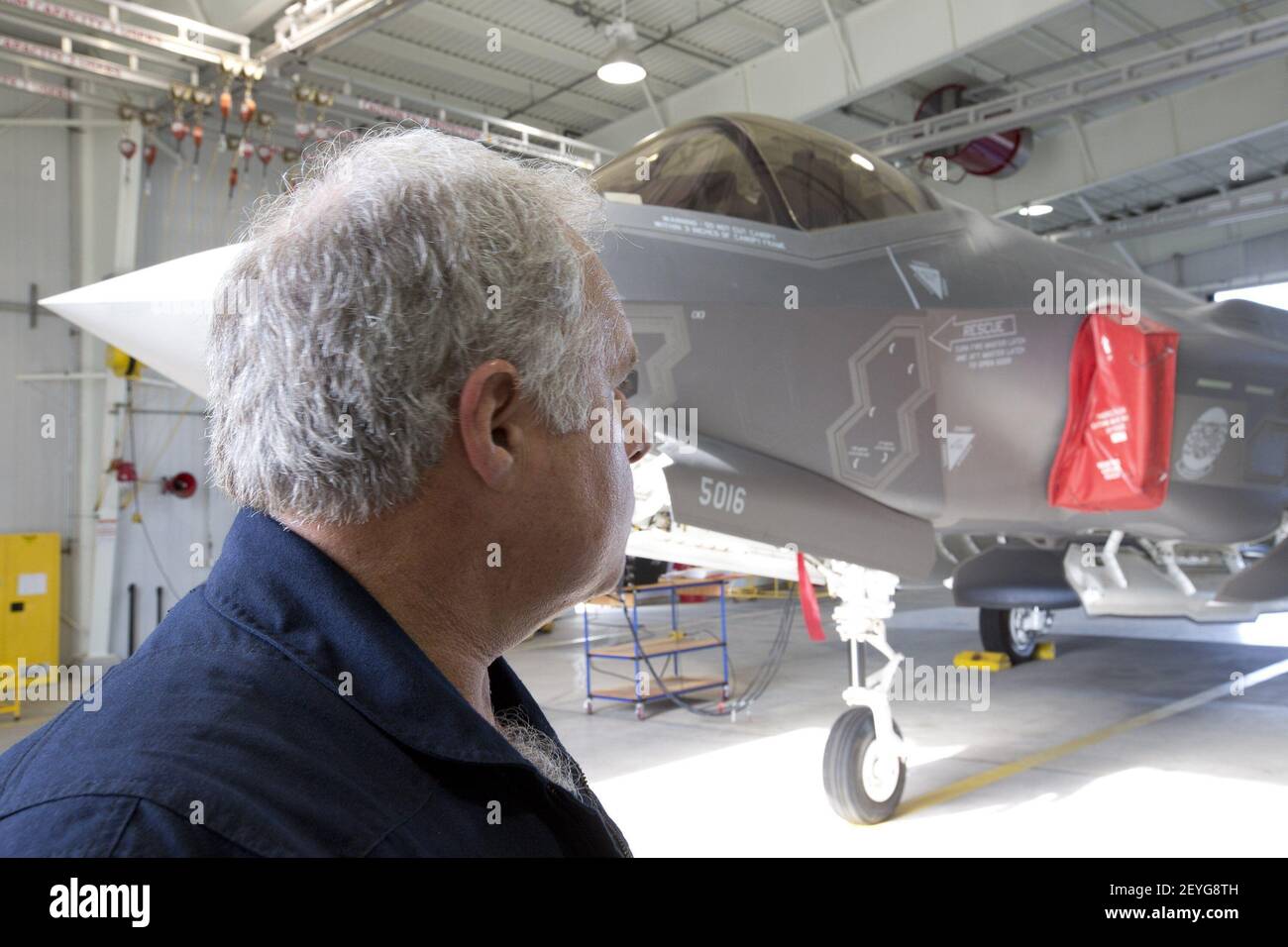 Lockheed Martin chief test pilot Alan Norman checks out an F-35A being ...