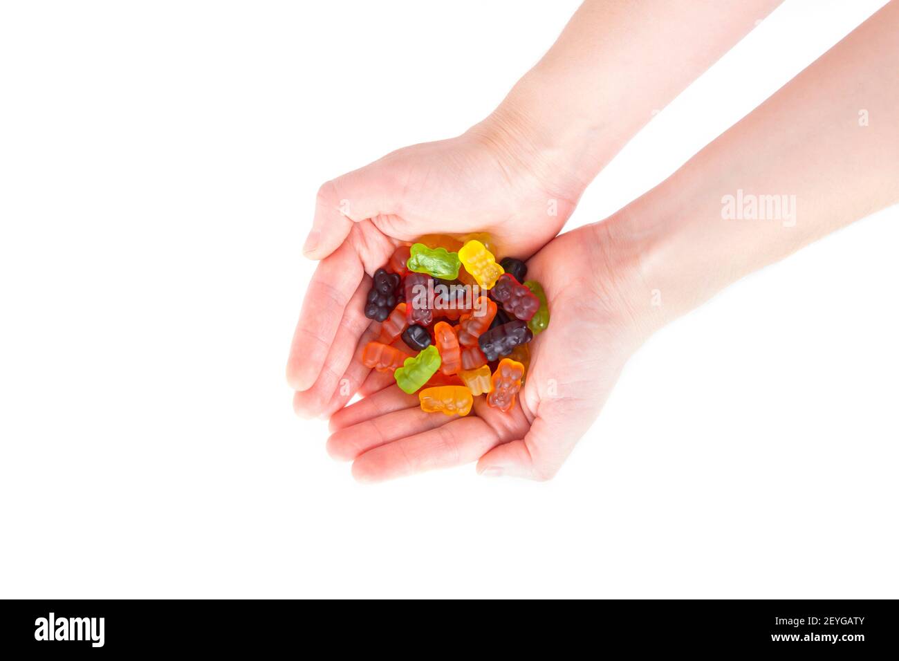 Top view of female hands full of multicolored gummy bears isolated on ...