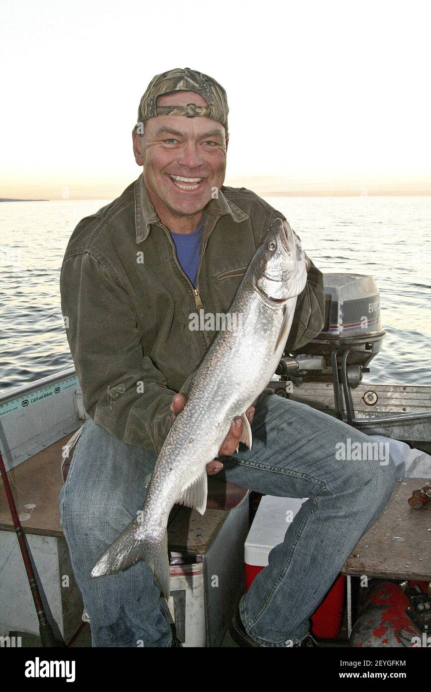 Tim Sonday of Two Harbors, Minnesota, holds the day's first lake trout ...