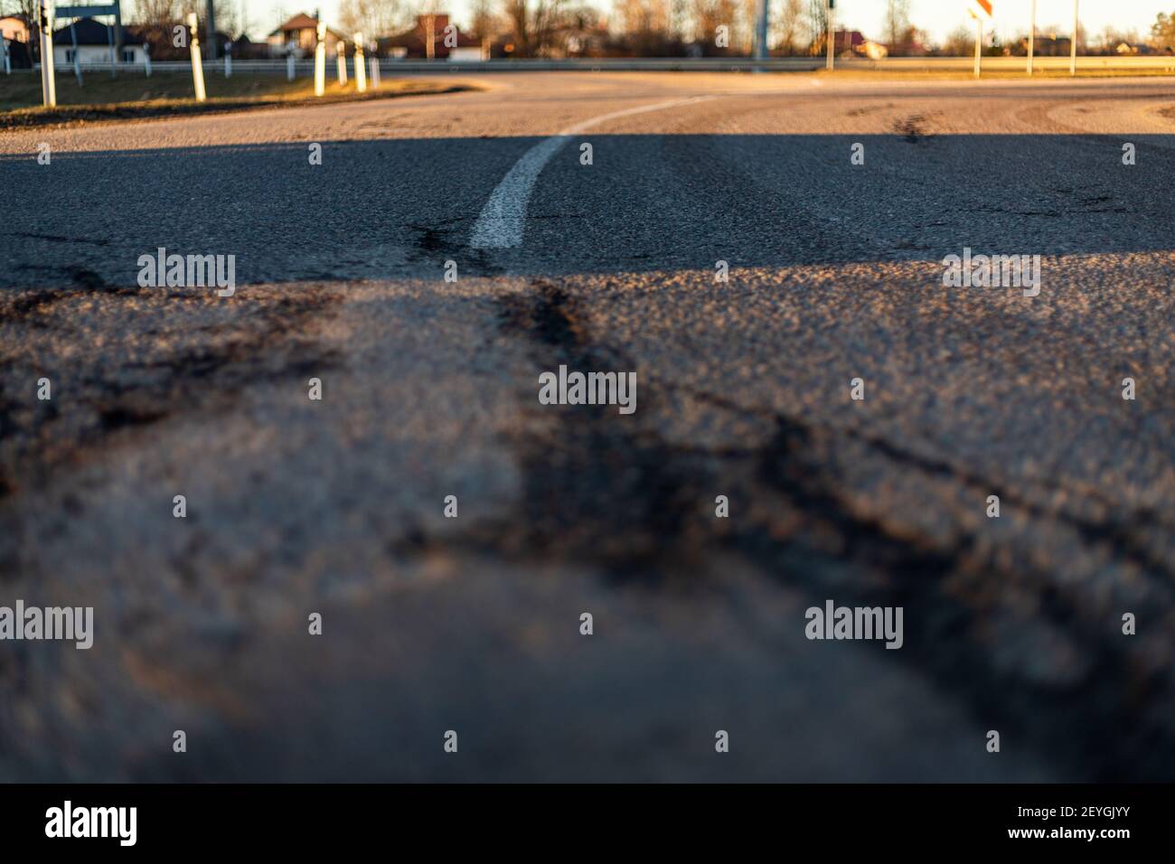 Black asphalt road and white dividing line Stock Photo - Alamy