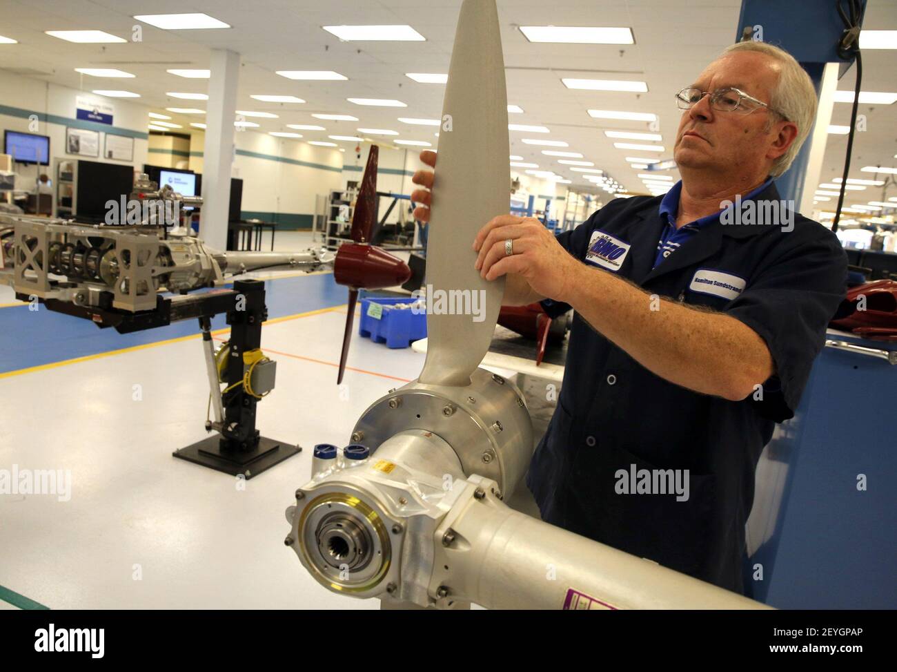 Mike Russell, a certified assembly technician at UTC Aerospace Systems ...