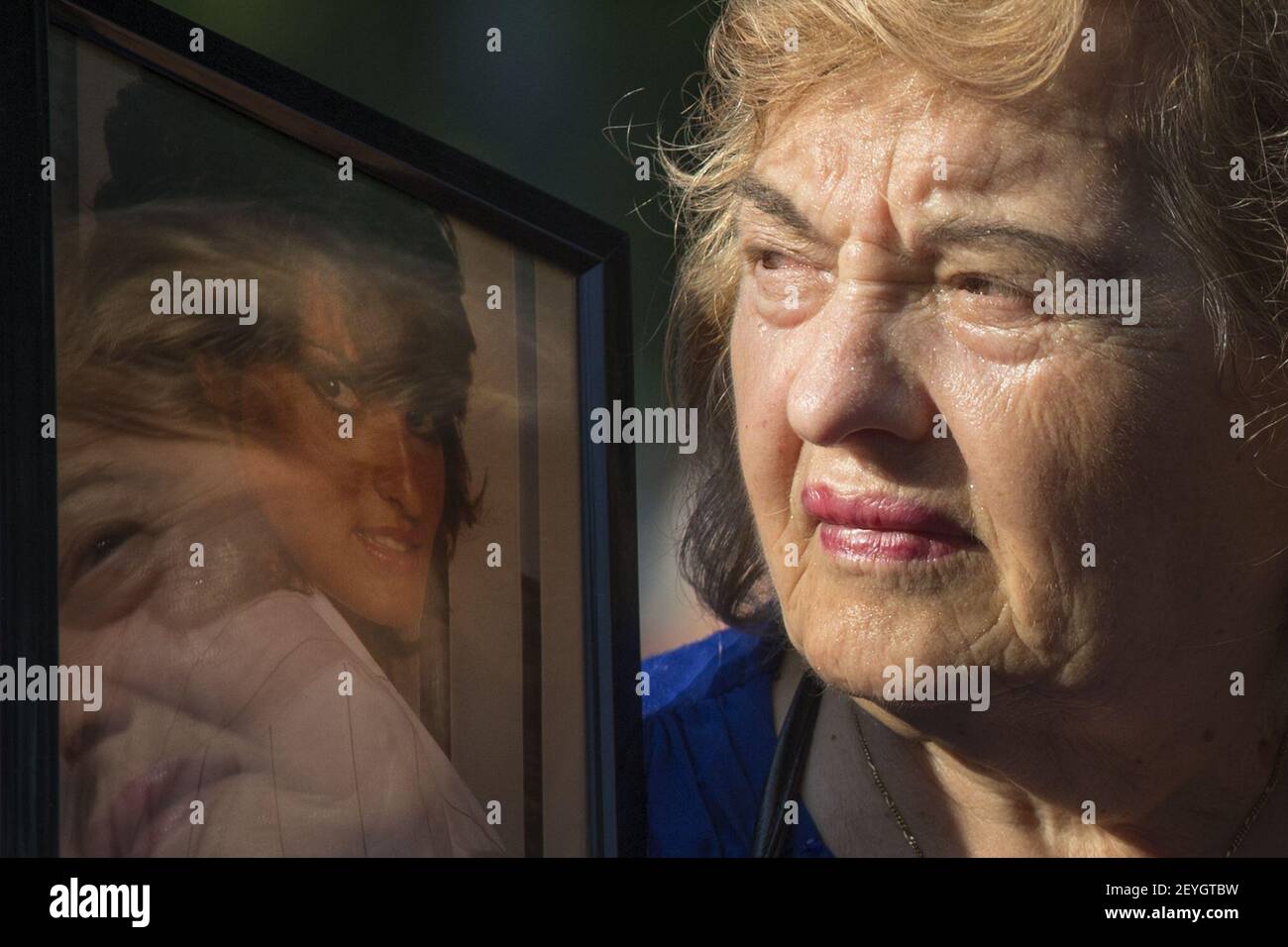 Ester DiNardo, mother of Marisa DiNardo, clutches her image while ...