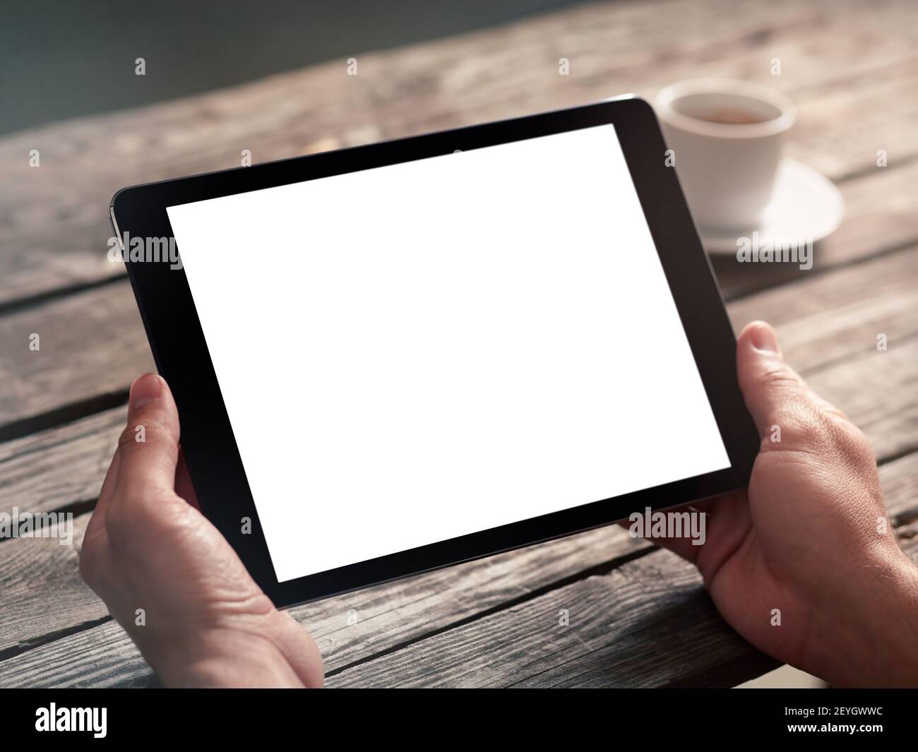 Digital tablet in male hands over background Stock Photo - Alamy
