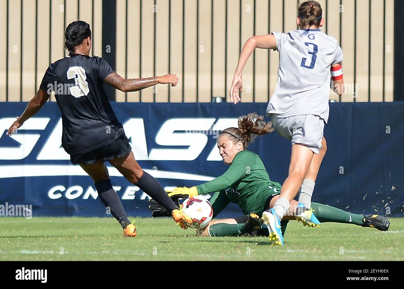 Georgetown goalkeeper Emma Newins (1) leaves the goal to make a save ...