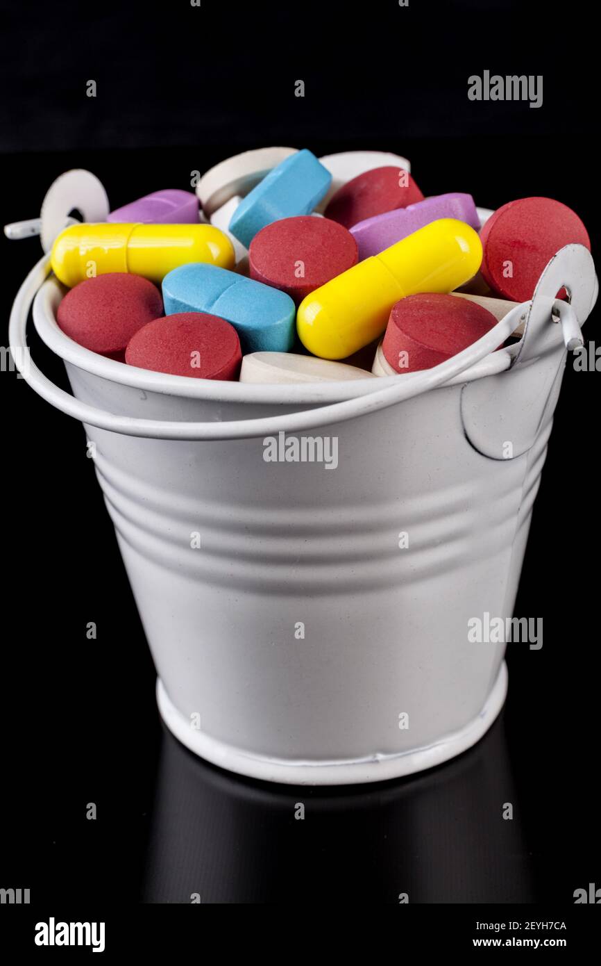Bucket of Pills Stock Photo - Alamy