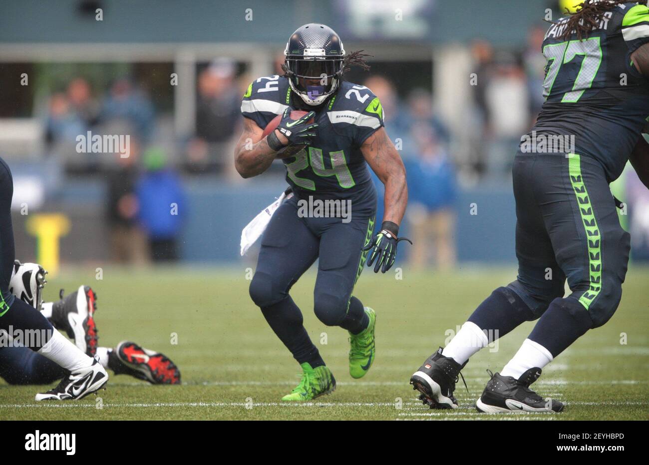Seattle Seahawks running back Marshawn Lynch breaks through a huge hole ...