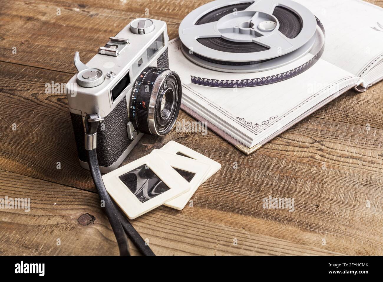 Open Notebook and Camera Stock Photo - Alamy