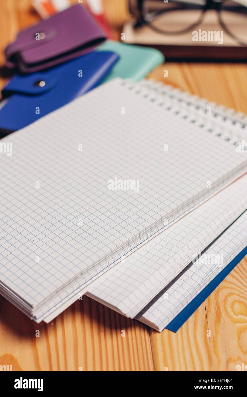 notepads pencils office work paper wood background Stock Photo - Alamy