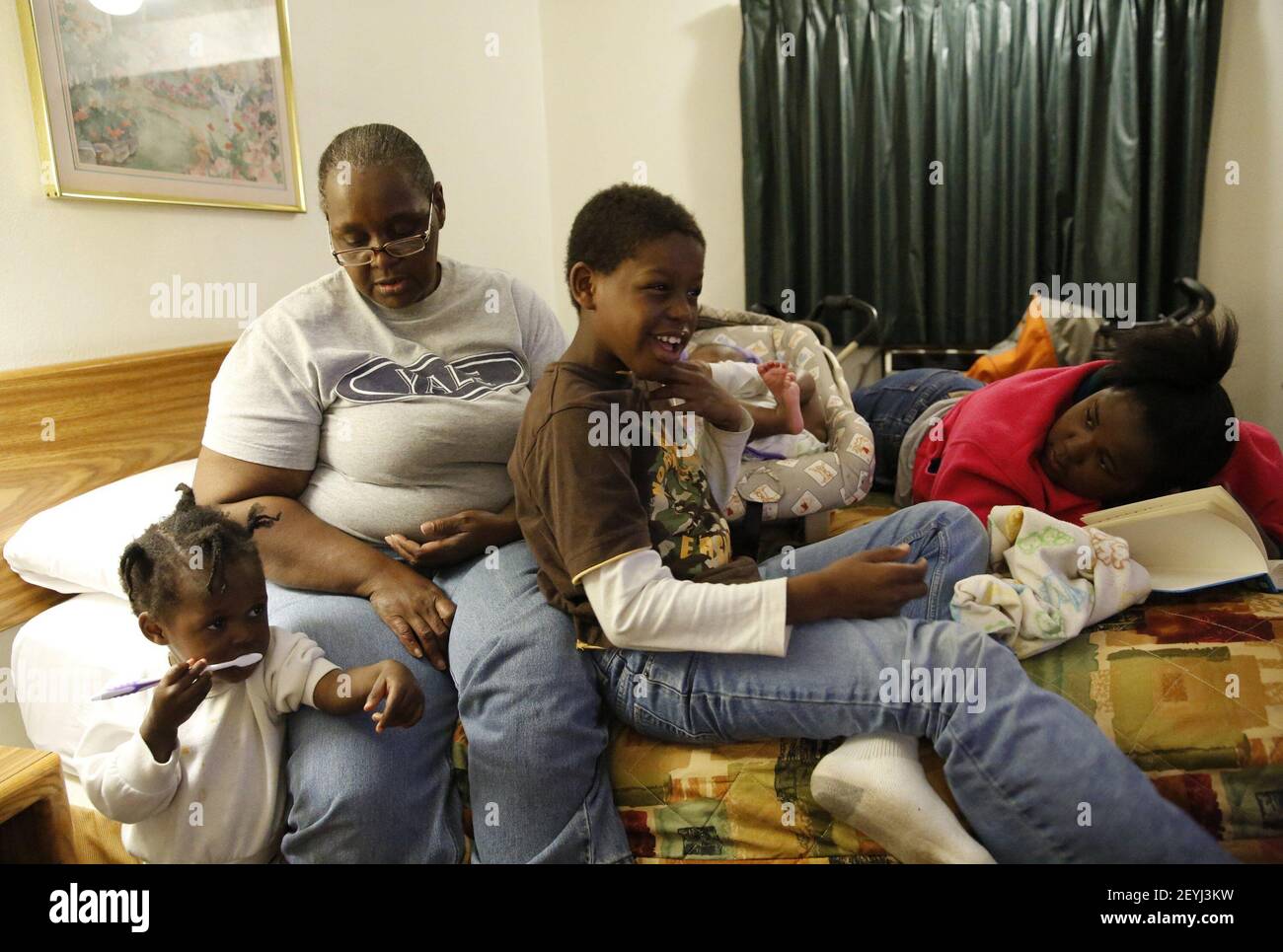 Angelisa Bullock sits with her grandchildren, Julyiah Jackson, 2, from ...