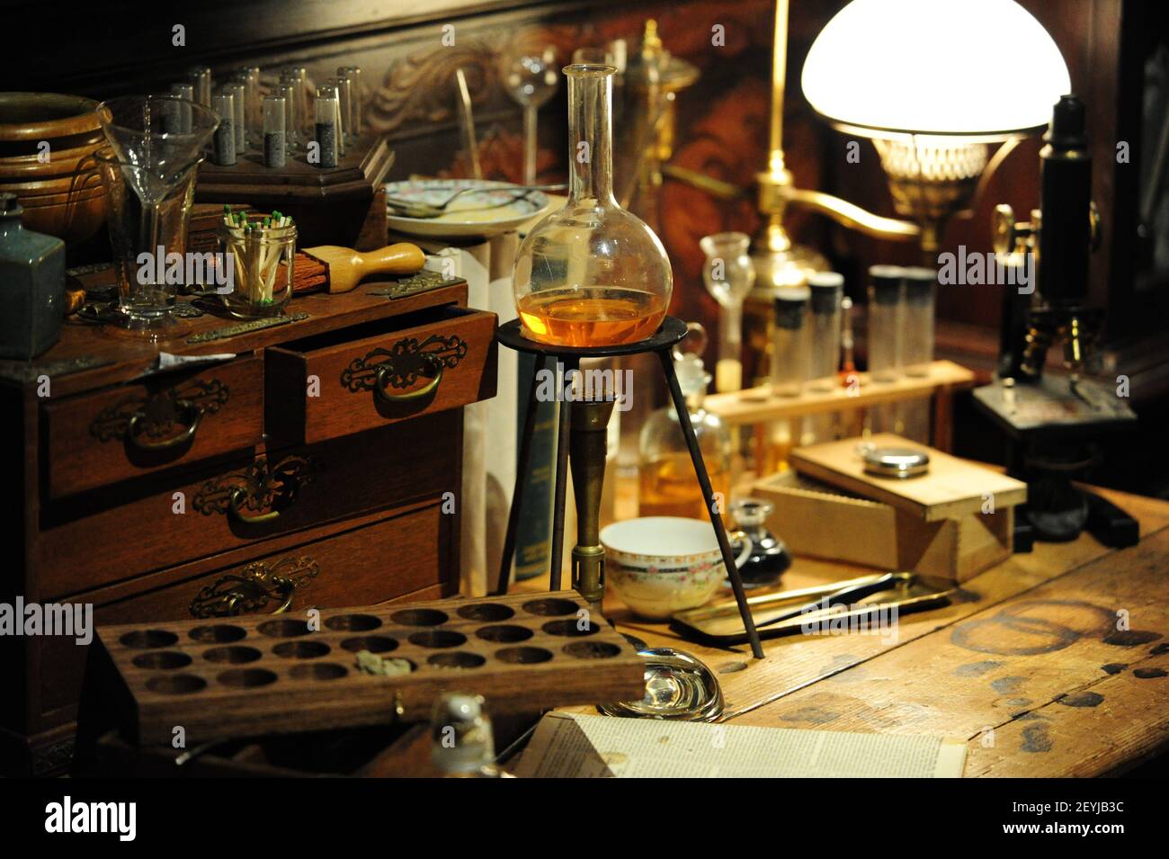 A bunsen burner and laboratory equipment in a room recreating the ...