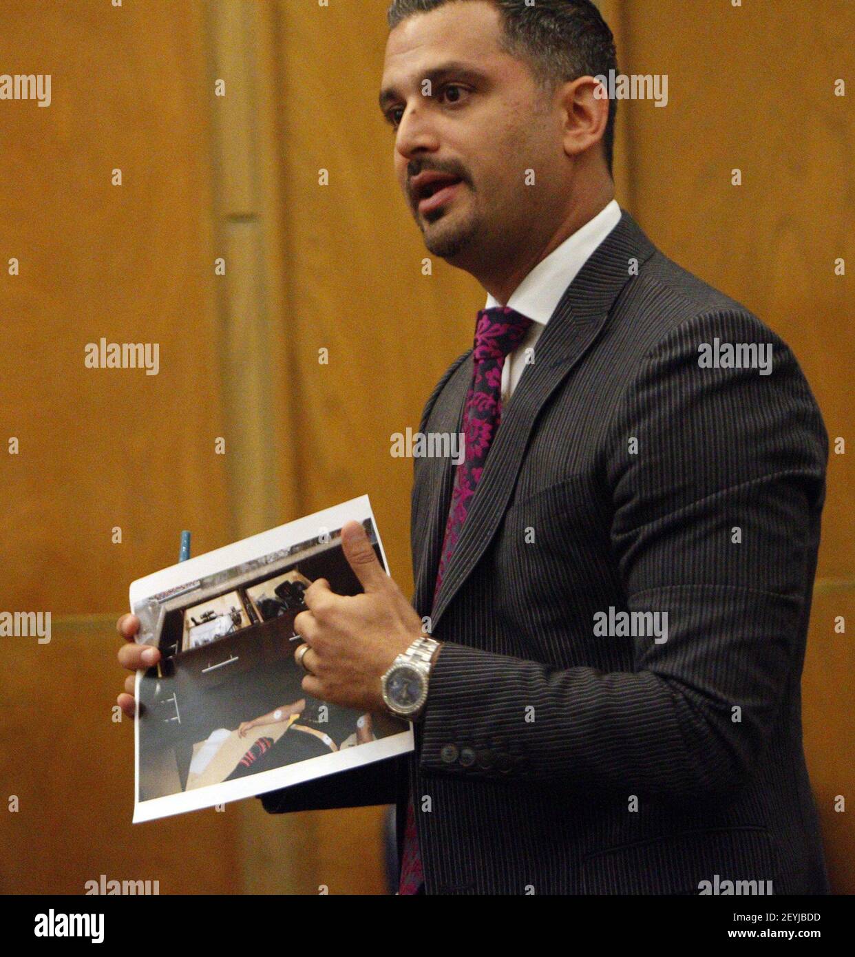 Defense attorney Saam Zangeneh holds a photo that shows victim Jennifer ...