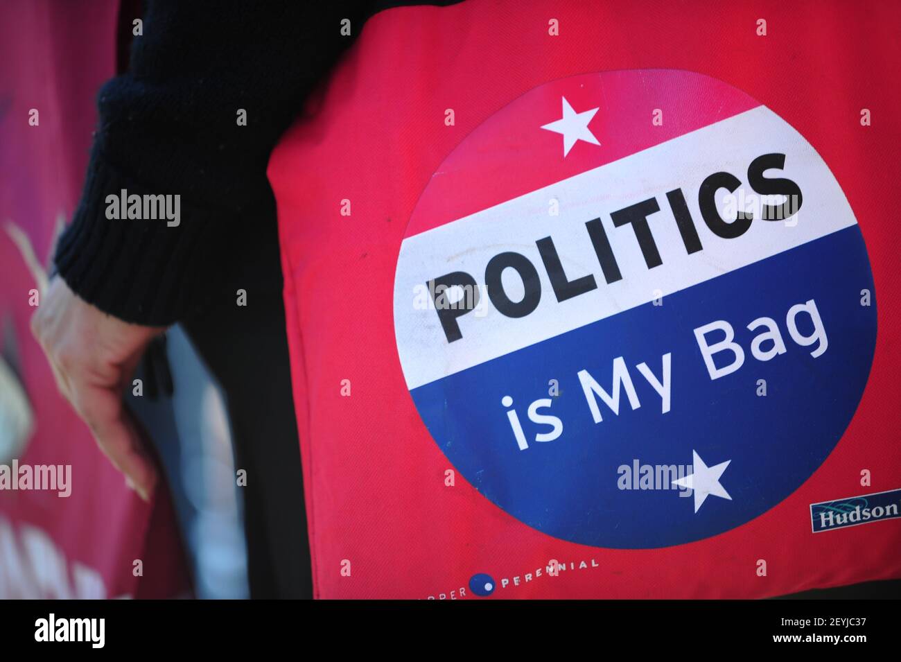 A woman wears a political bag at a protest asking for the release from ...
