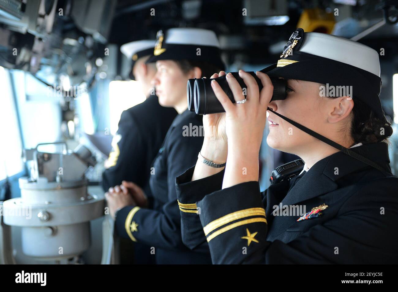 U.S. Navy Lt. j.g. Stephanie Conte, right, assigned to the guided ...