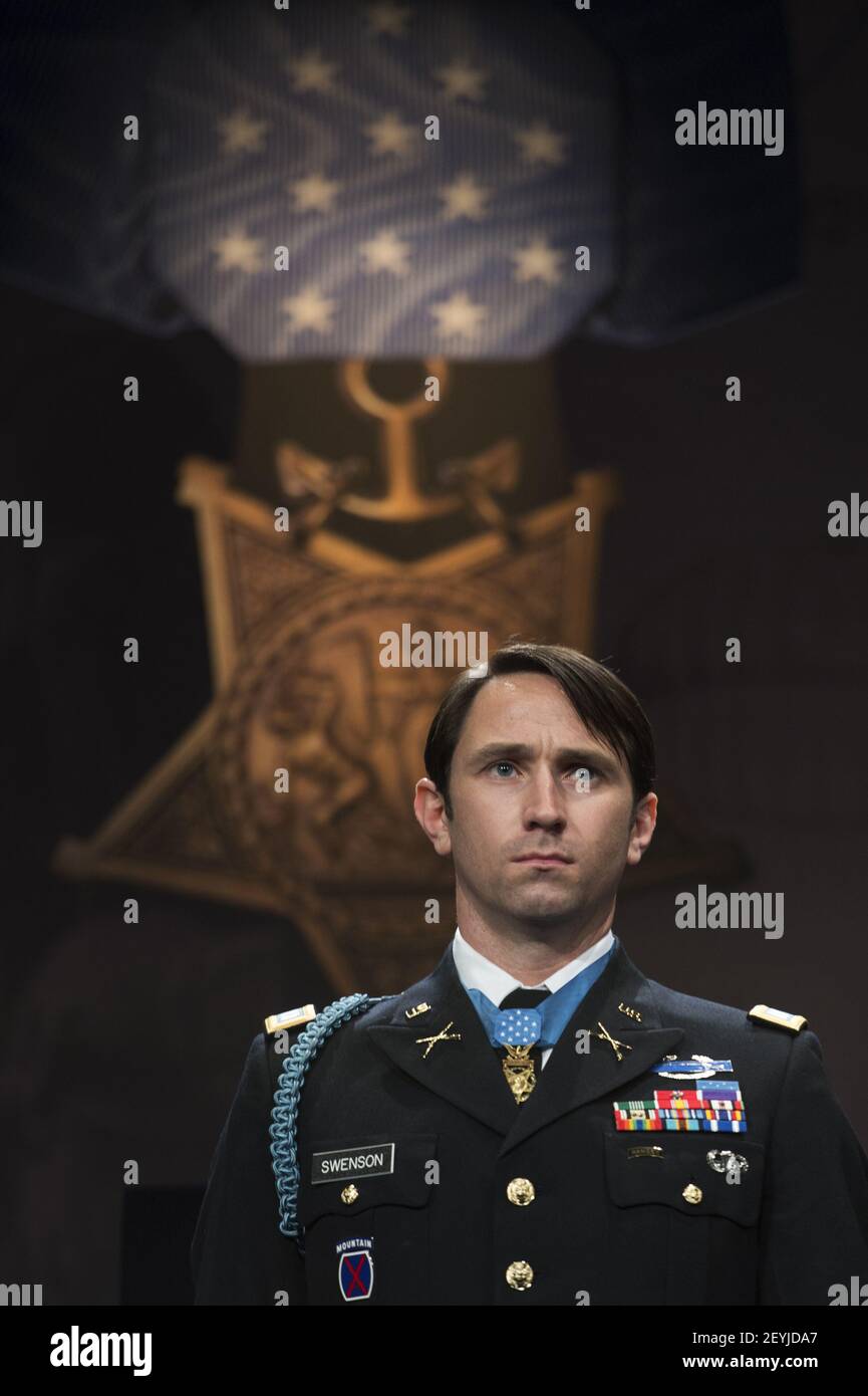 Former Army Capt. William Swenson stands before a crowd during his ...