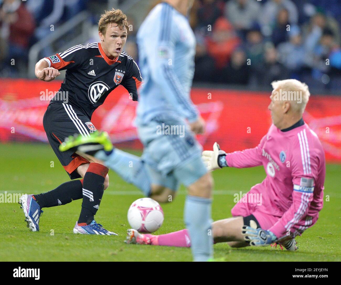 Sporting KC goalkeeper Jimmy Nielsen, riht, thwarts a shot on goal by D ...