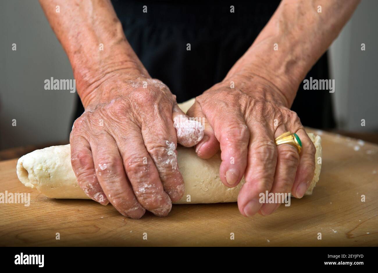 Instead of using a mixer, Hok Kun Ng, 89, of Overland Park, uses his ...