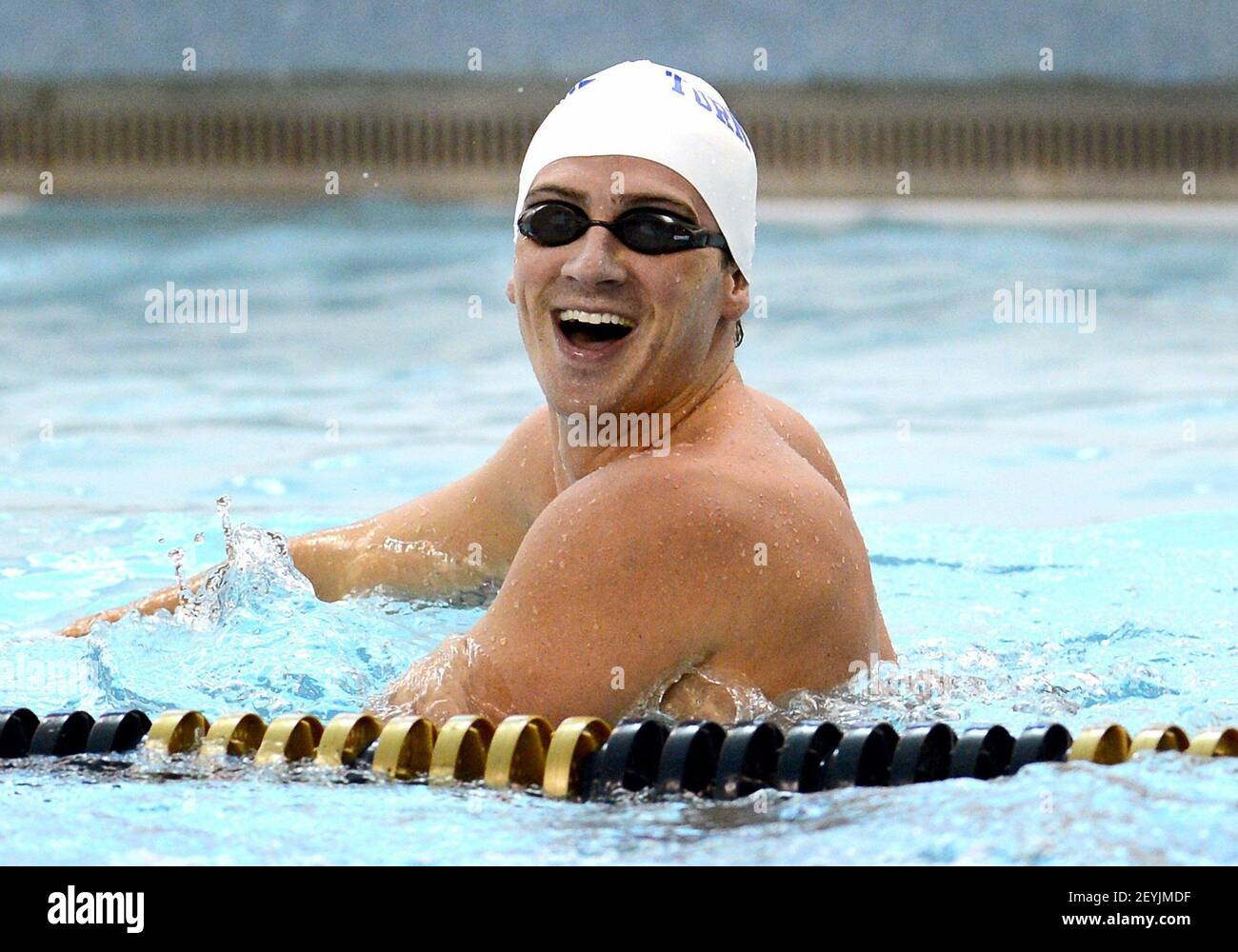 Olympic swimmer Ryan Lochte turns and smiles at SwimMac coach David ...