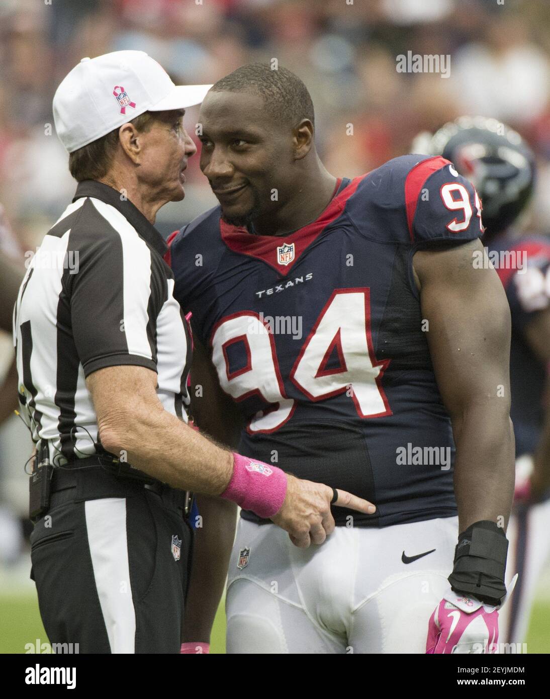 Antonio Smith (94) of the Houston Texans talks with referee Bill Leavy ...