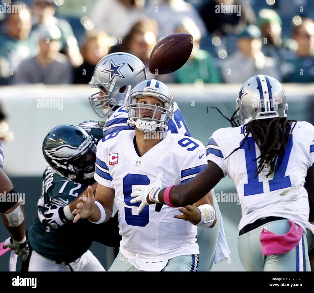 Dallas Cowboys' Tony Romo loses control of the snap, but recovered the ...