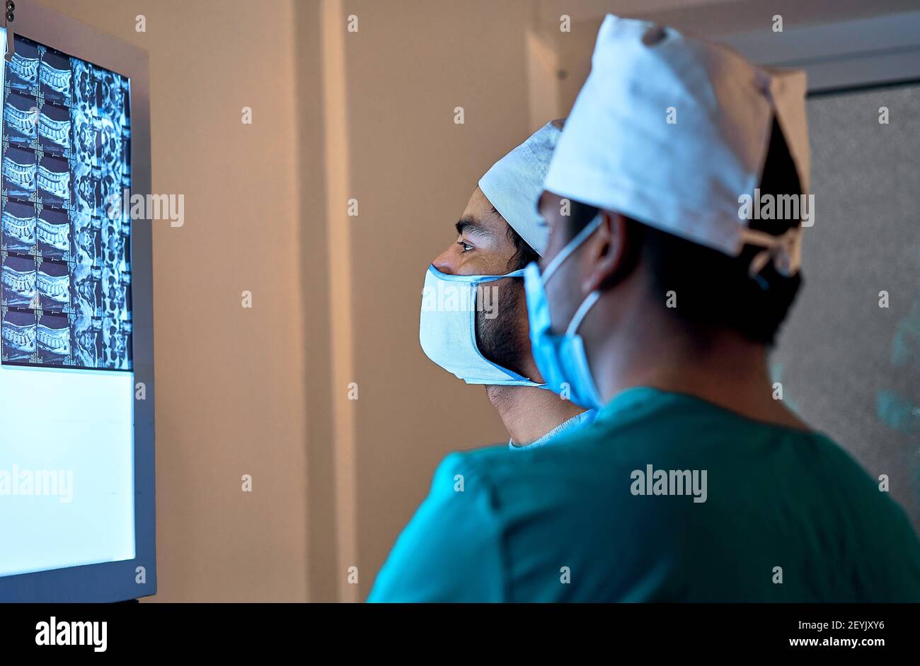 Pulmonologist and general surgeon watching x-ray scan before surgery ...