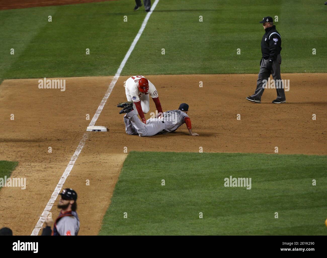 The St. Louis Cardinals' Allen Craig trips over Boston Red Sox third ...