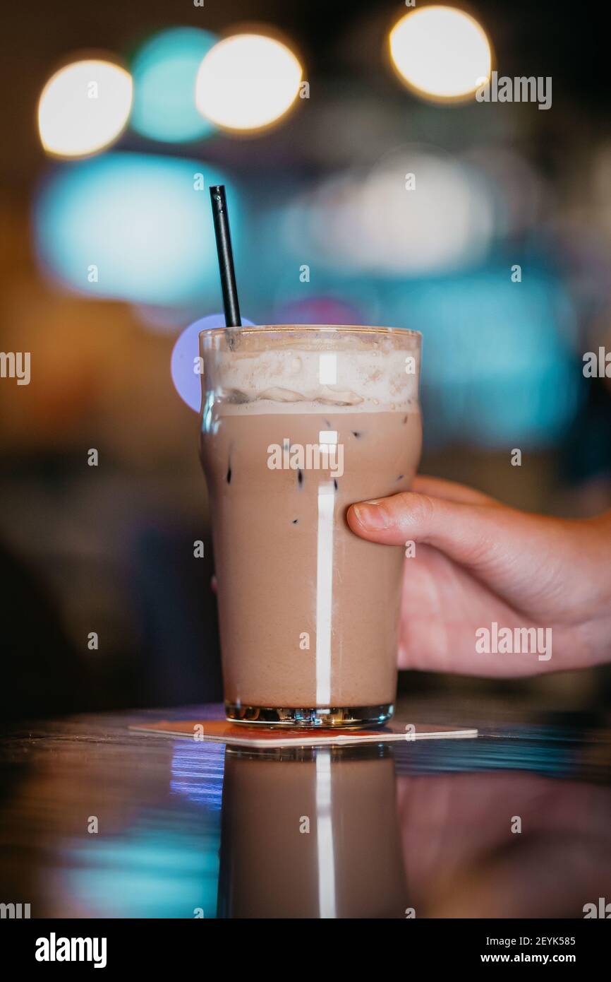 Man holding an iced coffee hi-res stock photography and images - Alamy