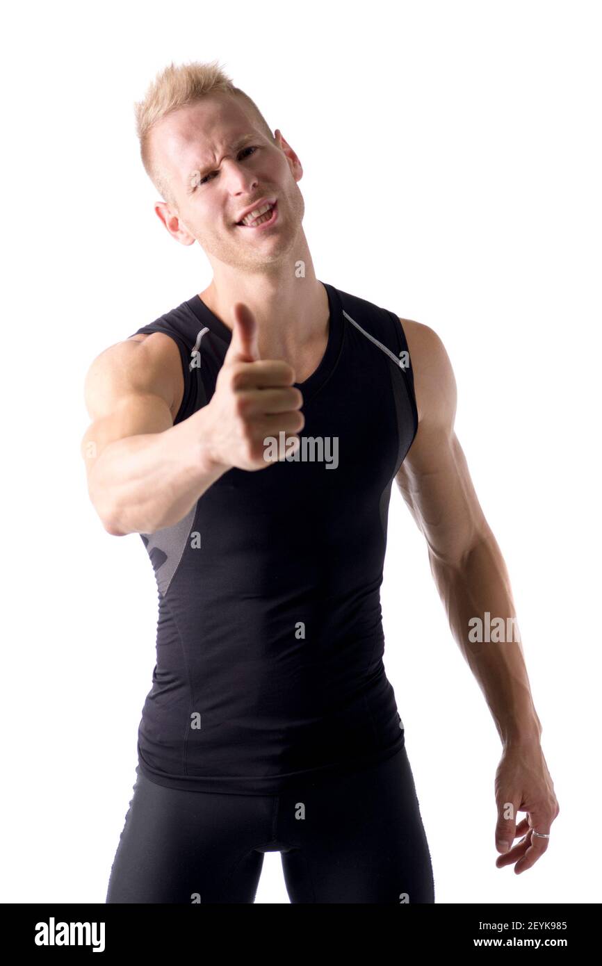 Handsome young man with thumb up doing OK sign Stock Photo - Alamy