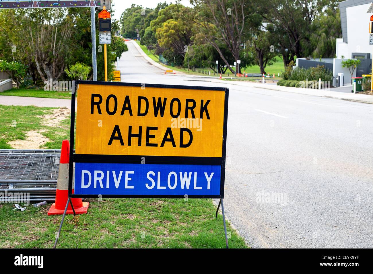 Roadwork ahead yellow warning sign on a suburban street Stock Photo - Alamy