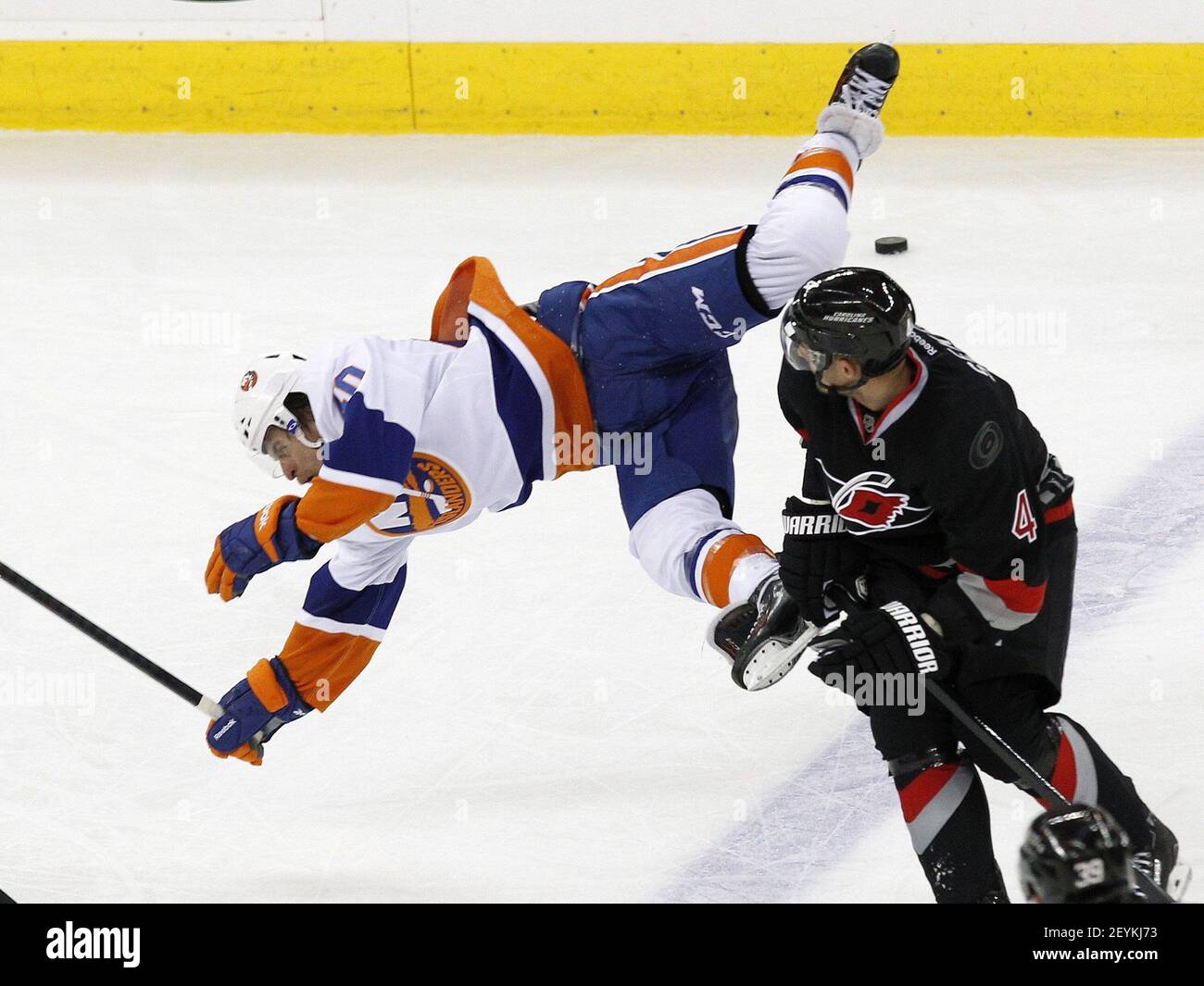 Andrej Sekera, right, of the Carolina Hurricanes upends Michael Grabner ...