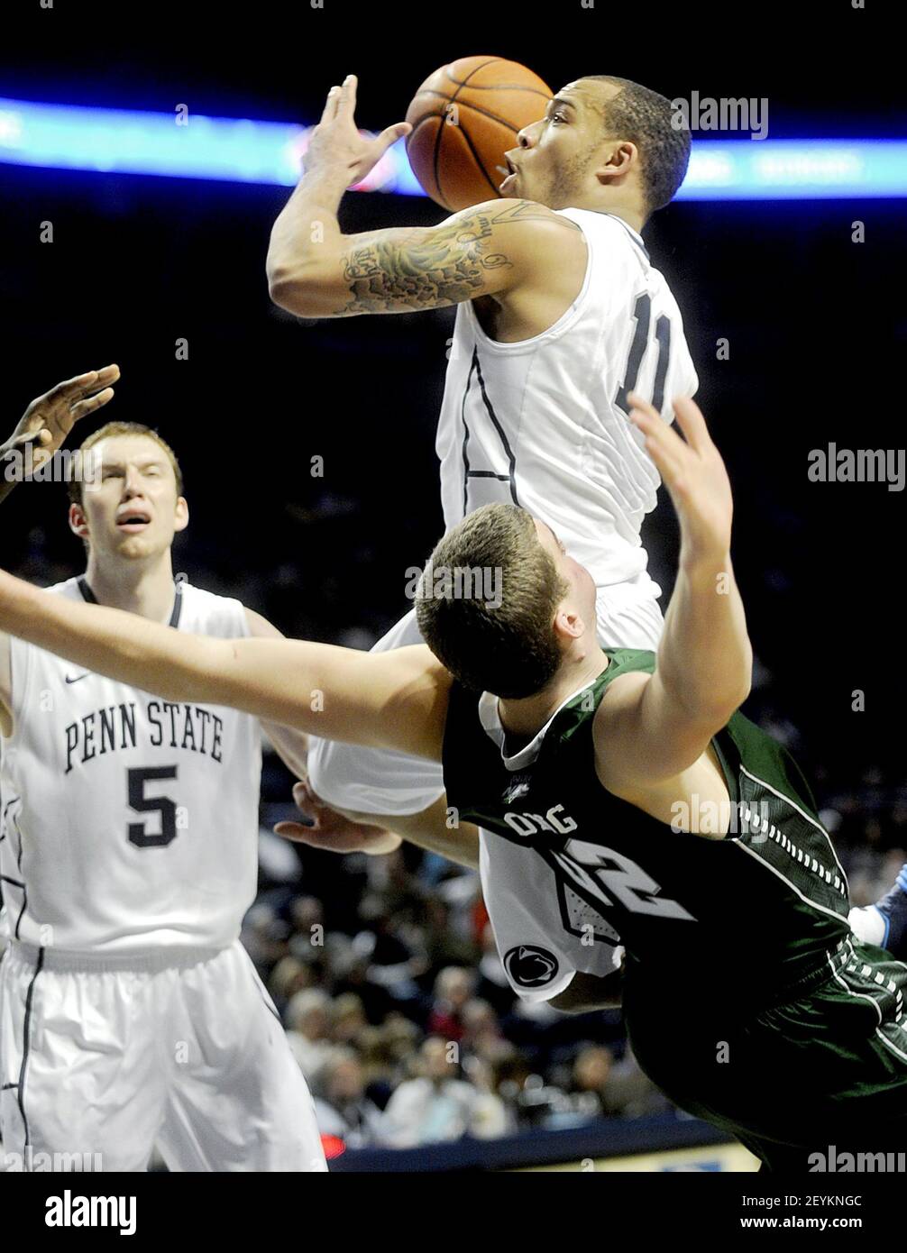 Allen Roberts of Penn State goes for a basket over Nolan Long of the ...