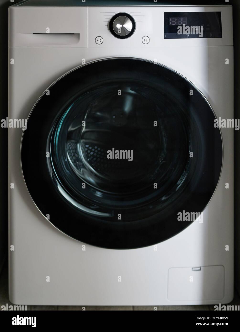 Modern washing machine front view with glass door Stock Photo - Alamy