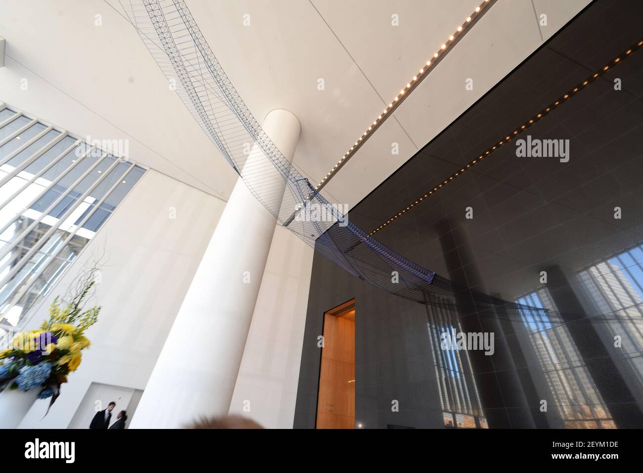 People stand in the lobby of Four World Trade Center, after the opening ...