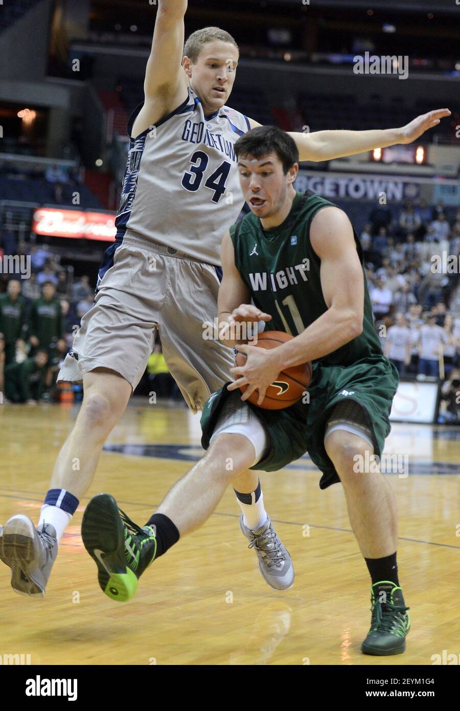 Forward JT Yoho (11) of Wright State tries to maintain control of the ...